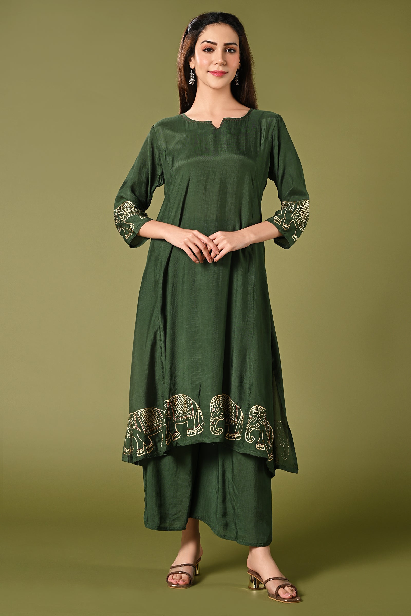 Solid green muslin kurti set with elephant print in border and sleeves ...
